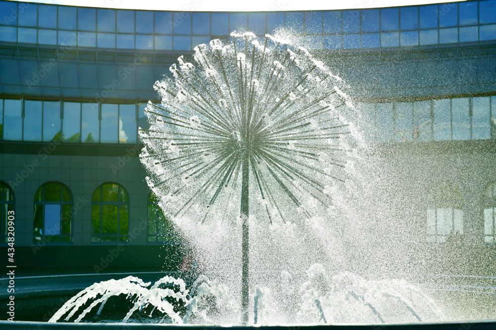 A spherical fountain spewing water under pressure. The fanning ...