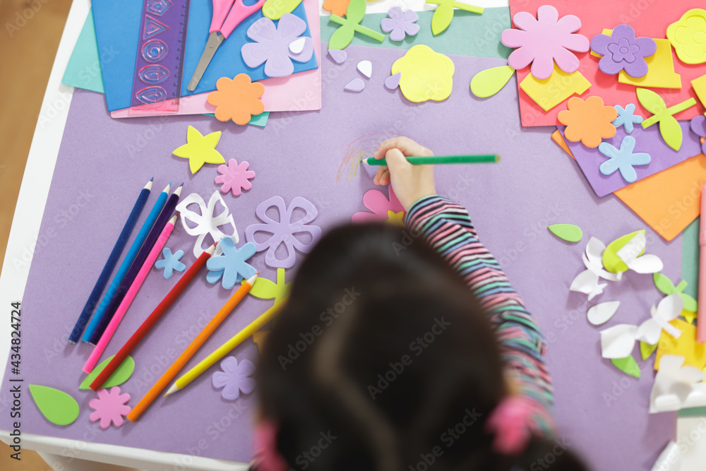 young girl making craft for homeschooling Stock Photo | Adobe Stock
