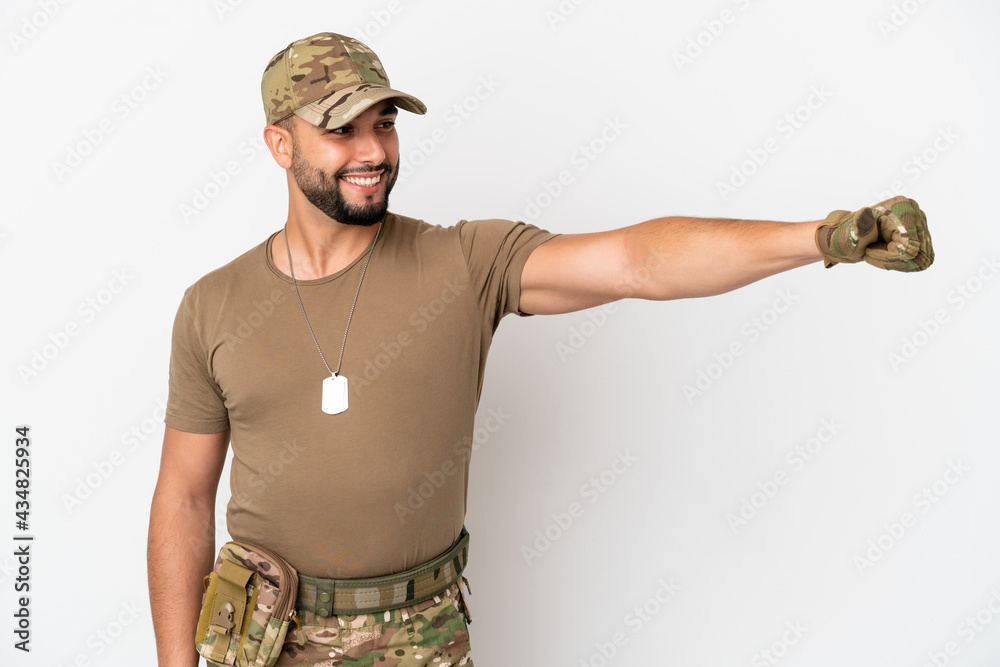 Young arab soldier man isolated on white background giving a thumbs up ...