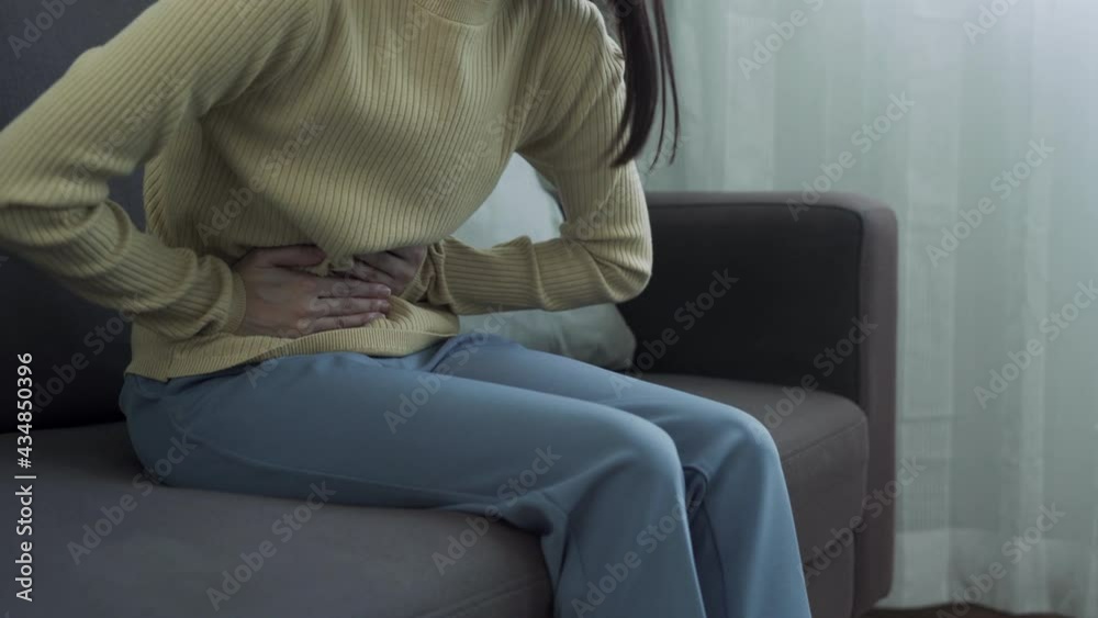 Girl siting has diarrhea and severely toxic food. women living at home ...