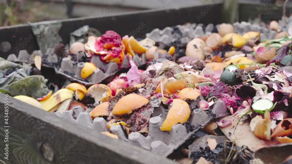 A close-up of the camera pan over the food waste compost heap. Organic ...