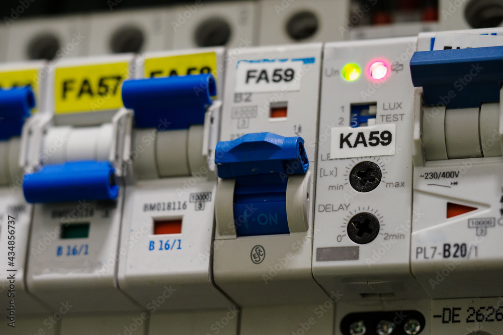 Time relay with LED lighting in a switchboard with circuit breakers ...