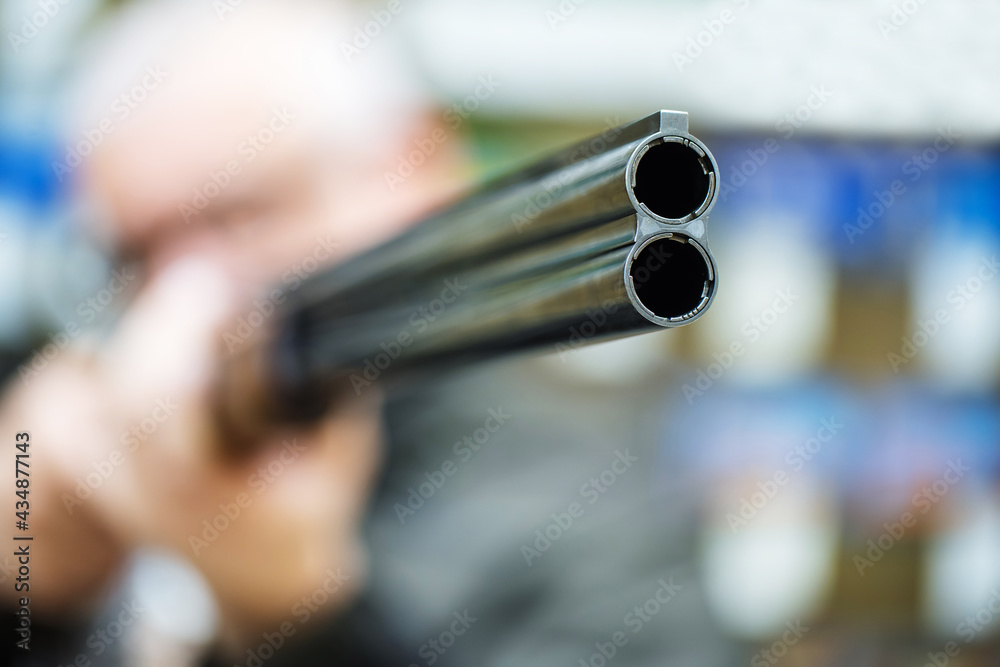 Double-barreled shotgun. The moment of aiming to check the weapon for ...