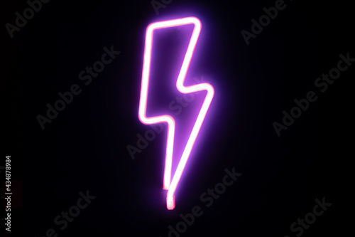 Purple lightning bolt mounted neon signs. High-voltage neon symbol ...