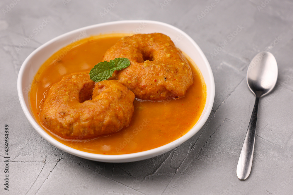 Indian street food Sambar vada , Medu Vada soaked in tiffin sambar ...