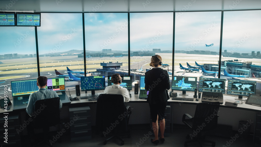 Diverse Air Traffic Control Team Working in a Modern Airport Tower ...