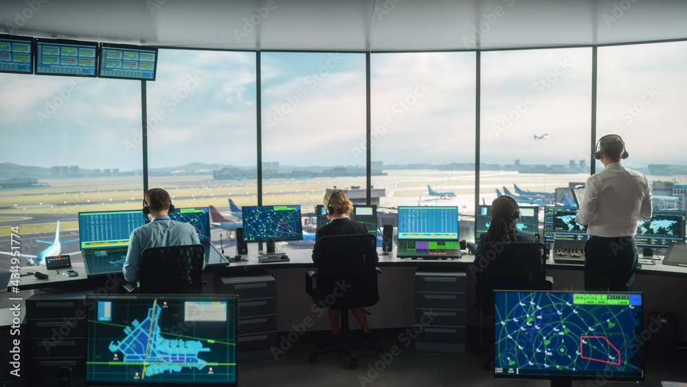 Diverse Air Traffic Control Team Working in a Modern Airport Tower ...