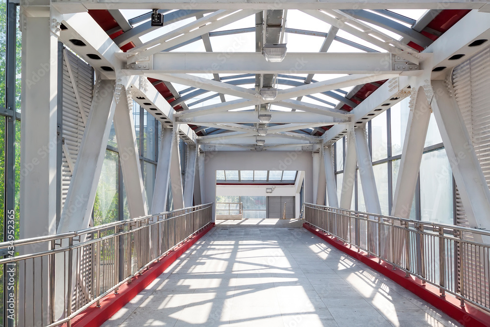 Pedestrian crosswalk under glass roof passage in urban environment ...