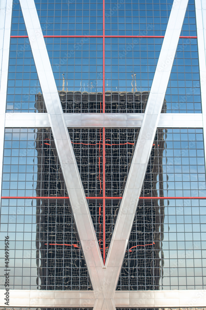 V-shaped structure of a building with crystals reflecting the sky and ...