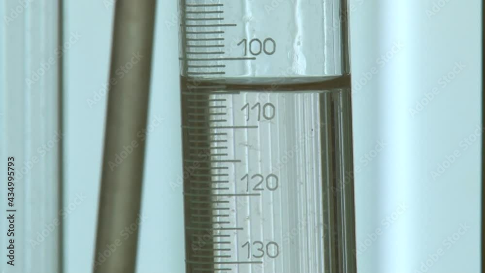 water in a beaker. water in a glass beaker on a white background ...