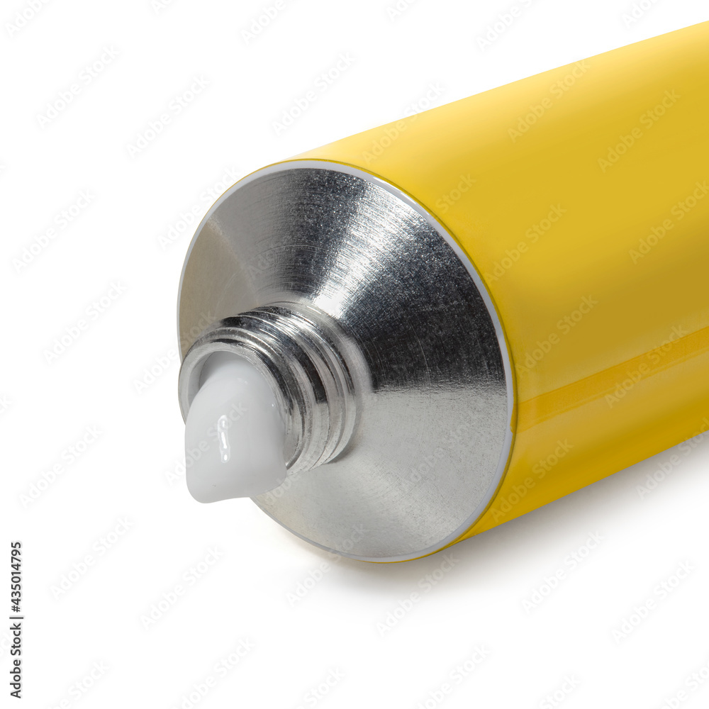 Yellow tube of ointment on a white background. Full depth of field ...