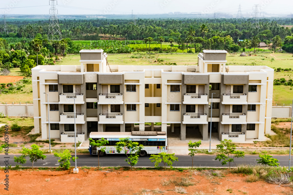 Top view of an Indian colony with bitumen road , building looking in ...