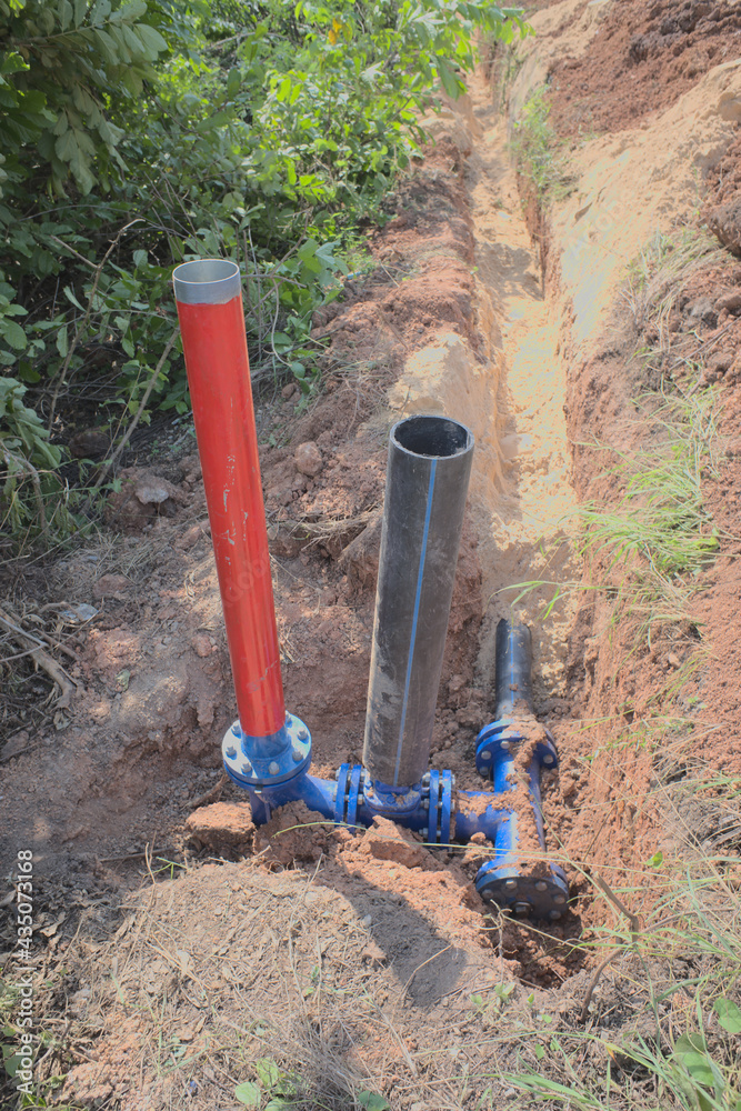 Plumbing During construction,Plastic pipes in the ground,Red pipe for ...
