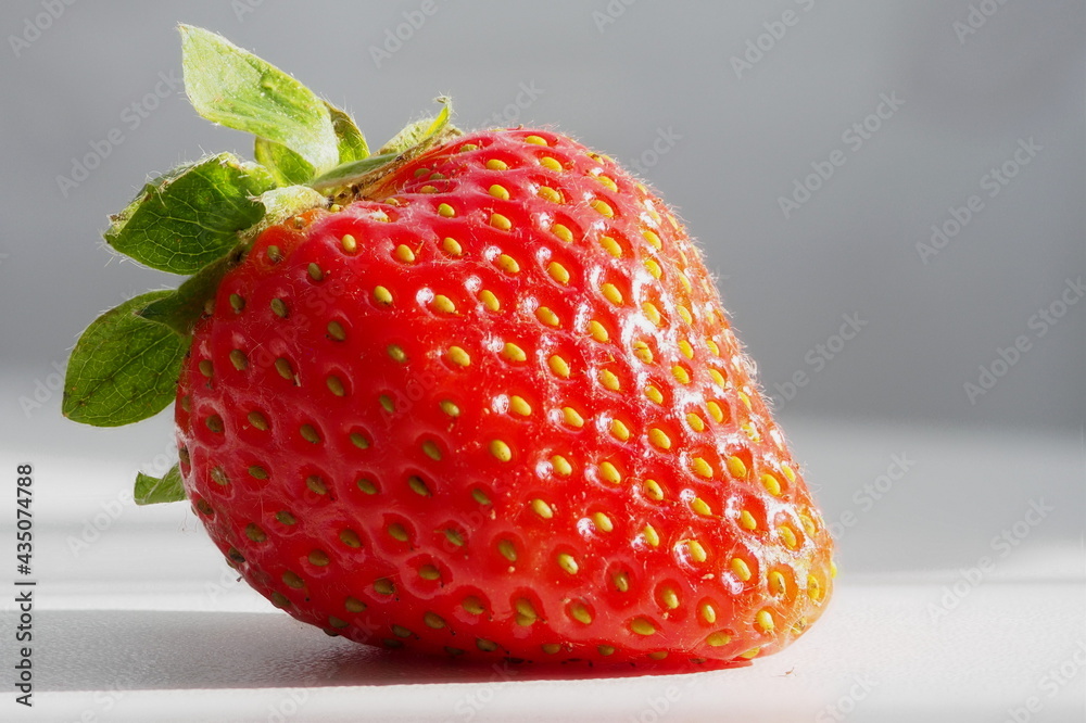Picture of one strawberry background, strawberry on white table or ...