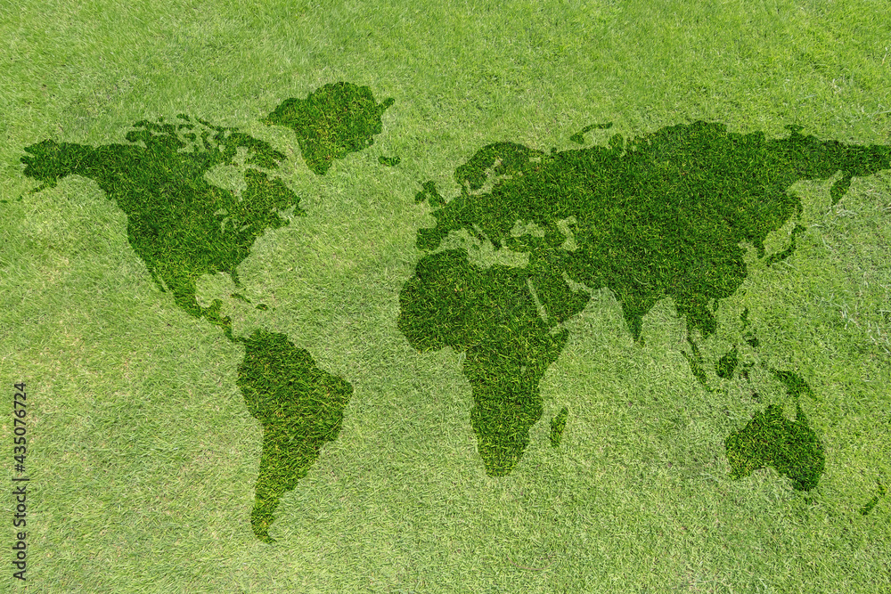 World map on green grass lawn background for global eco-friendly ...