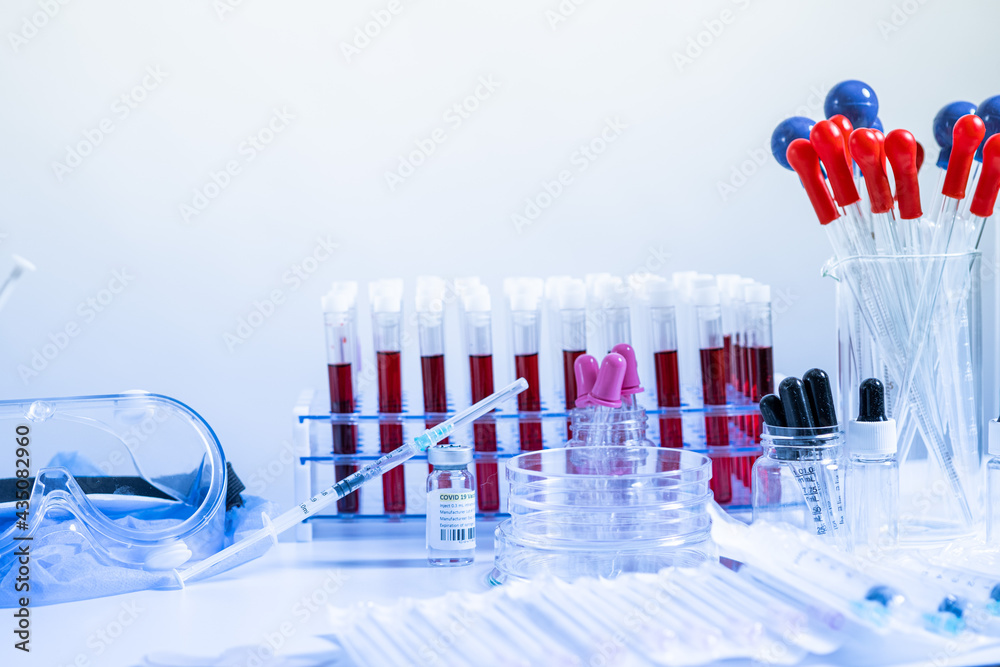 Glass bottle vial and syringe with Covid-19 Coronavirus vaccine in a ...