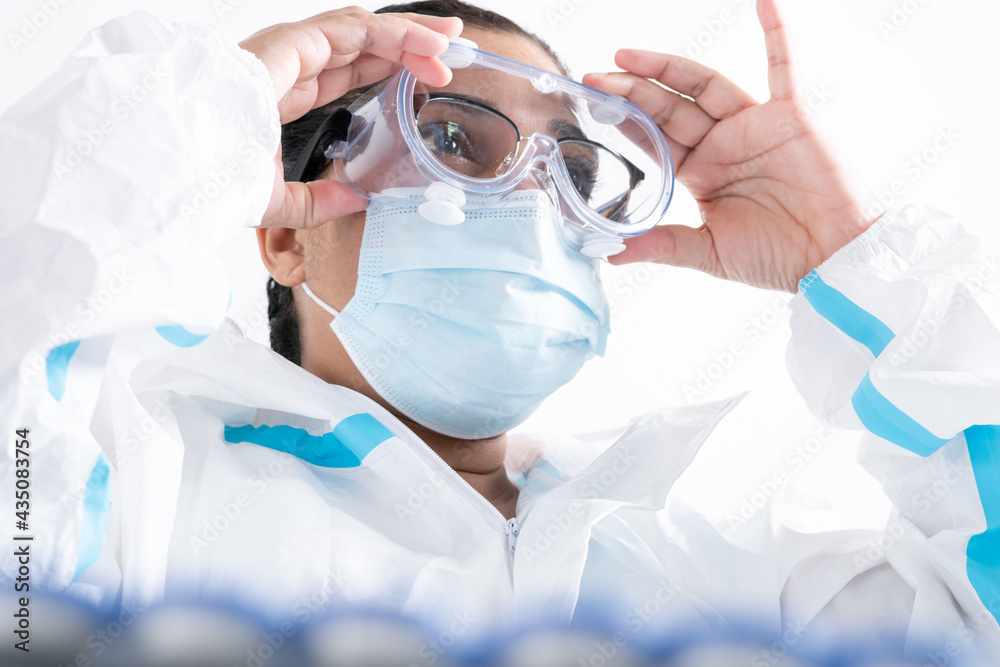 Female doctor or nurse during corona virus pandemic covid-19 prepares ...