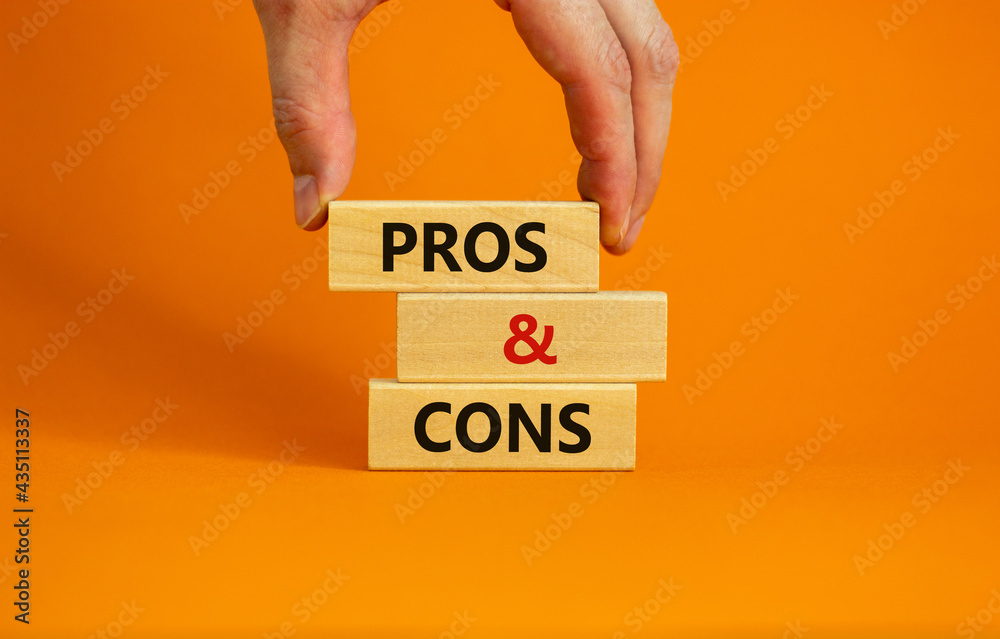 Pros and cons symbol. Wooden blocks with words 'Pros and cons ...