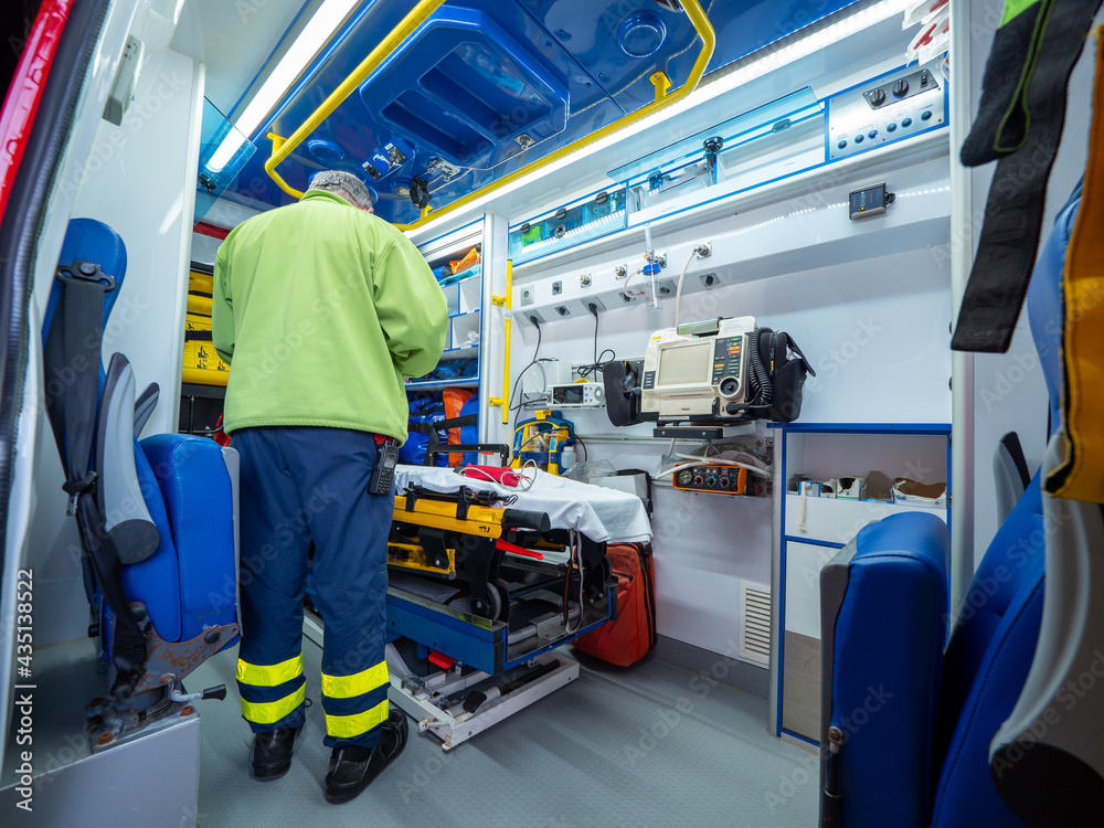 Inside an ambulance for the hospital with a nurse. Stock Photo | Adobe ...