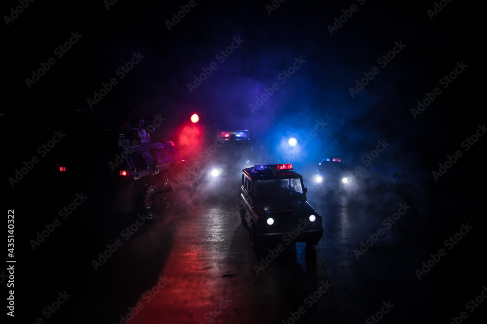 Police cars at night. Police car chasing a car at night with fog ...