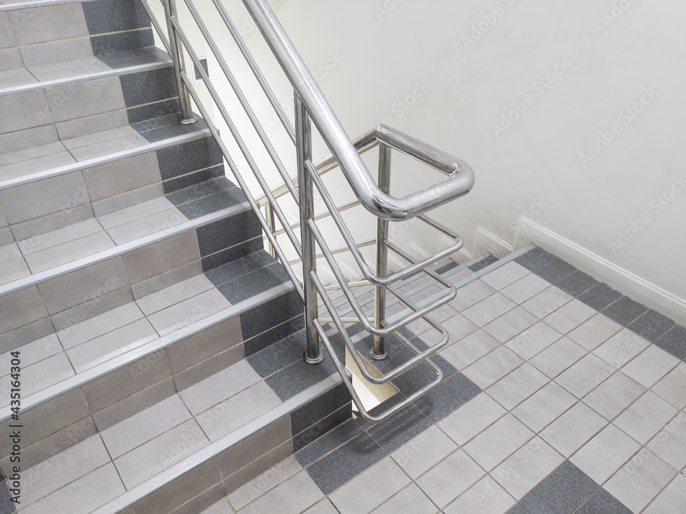 Modern staircase with metal stair nosing and aluminium railing handle ...