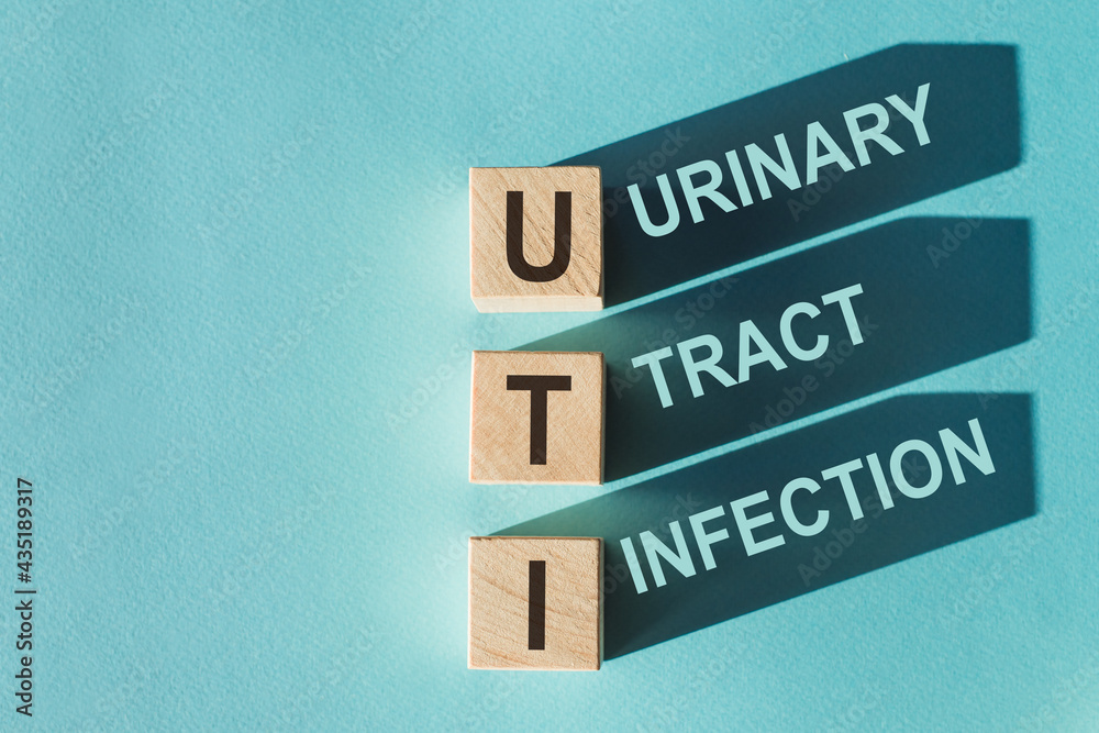 Wooden cubes building word UTI - (abbreviation Urinary Tract Infection ...