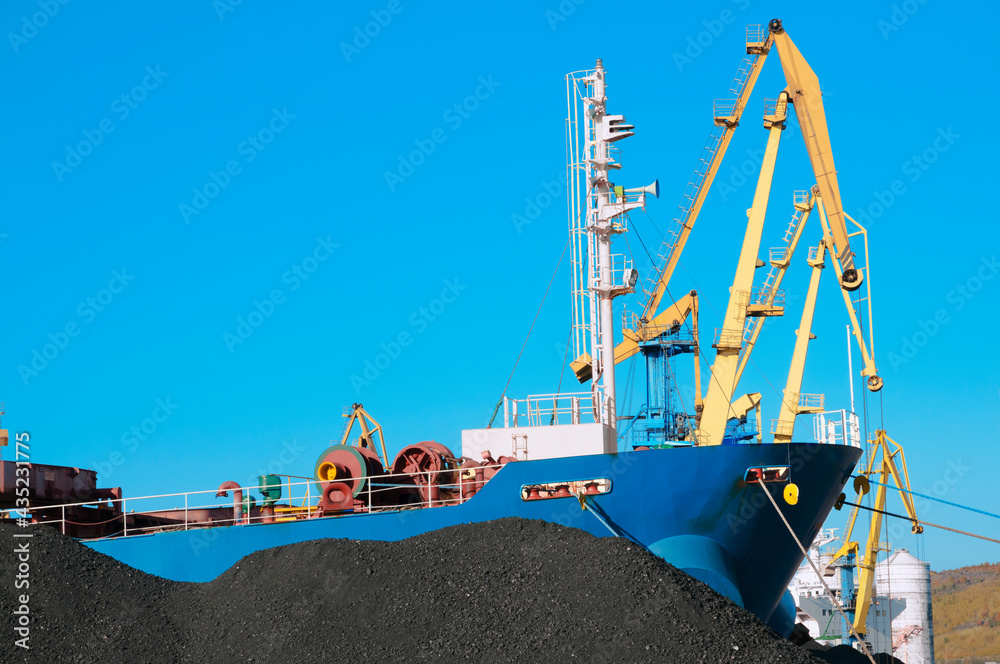 Huge amount of coal in the Murmansk commercial seaport. Loading of coal ...