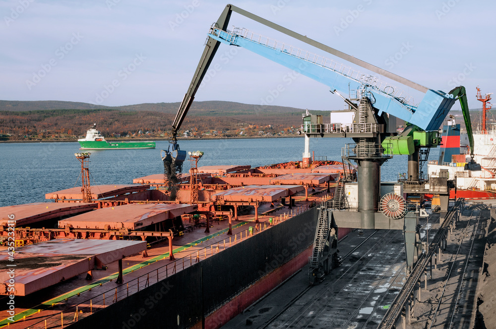 Industrial ships at the mooring wall in the seaport in the Kola Bay ...
