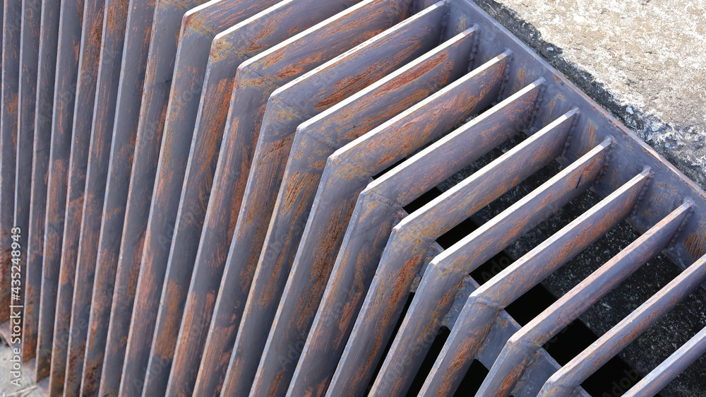 Old metal grid to trap garbage. Steel grating for trapping garbage on ...