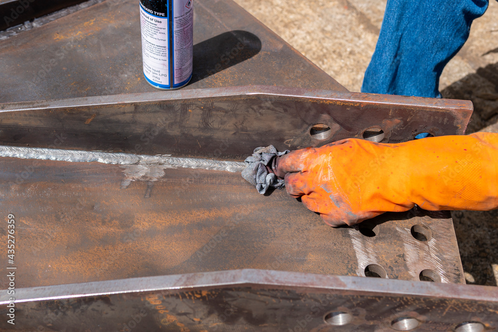 Step to use rag wipe Solvent Remover to cleaning the welded surface ...