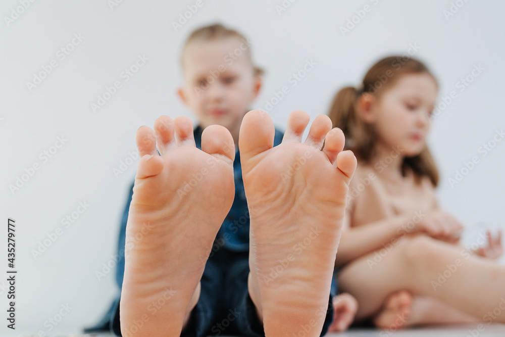 Boy's feet pads close up. rest is blurred. Rest of the image is blurred ...