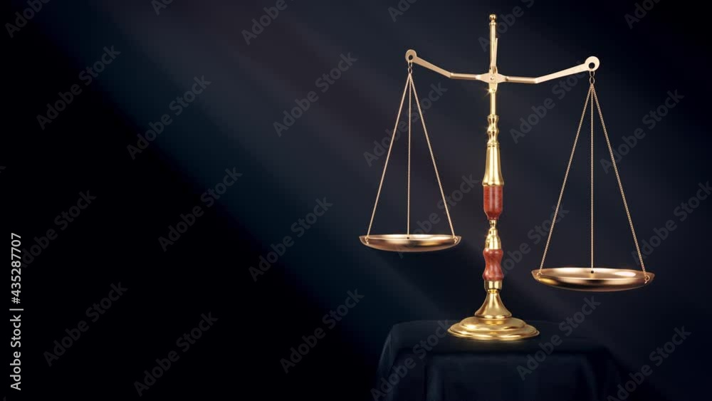 Golden traditional balance scale against a black background with rays ...