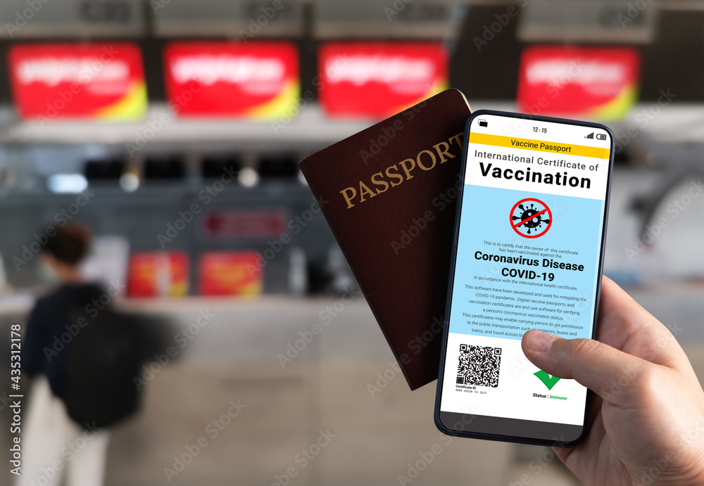 Traveler holds vaccine passport certificate to show COVID 19 ...