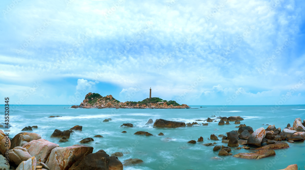 Ke Ga Lighthouse with surf patted smoother reefs create clouds on the ...