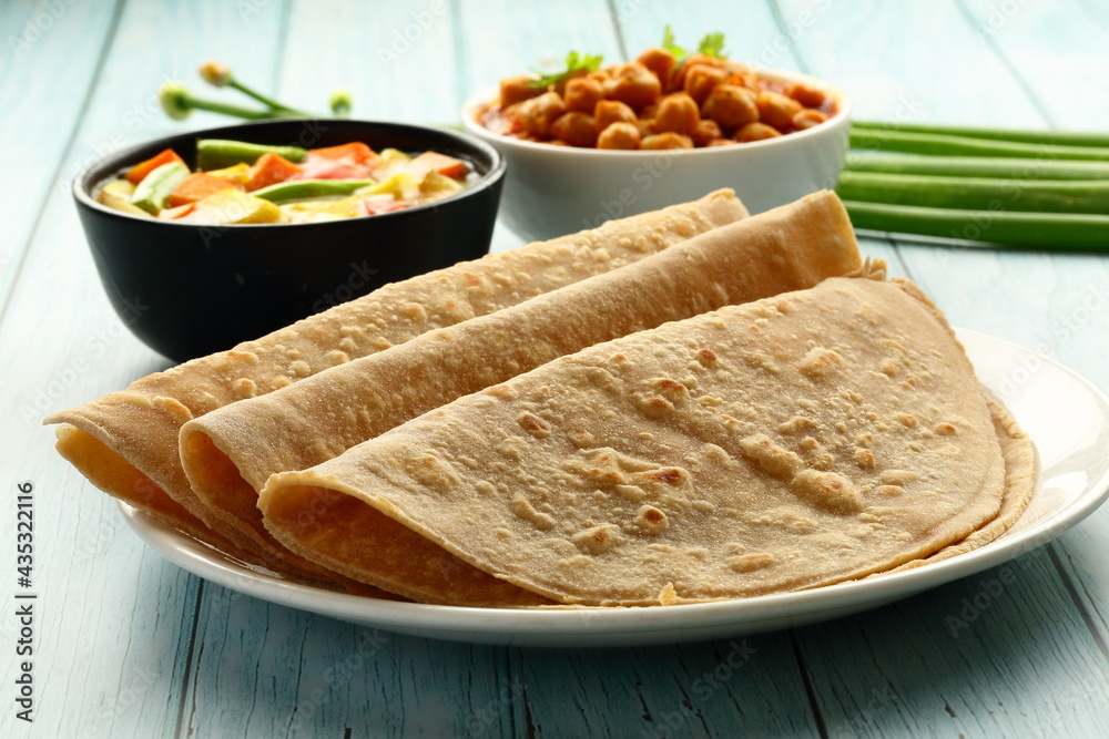 Homemade delicious whole wheat chapati served with chickpeas ,masala ...