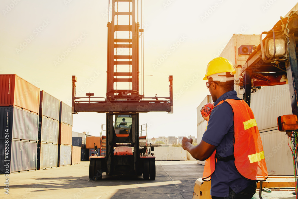 Teamwork, control workers work on cranes, loading intermediate ...