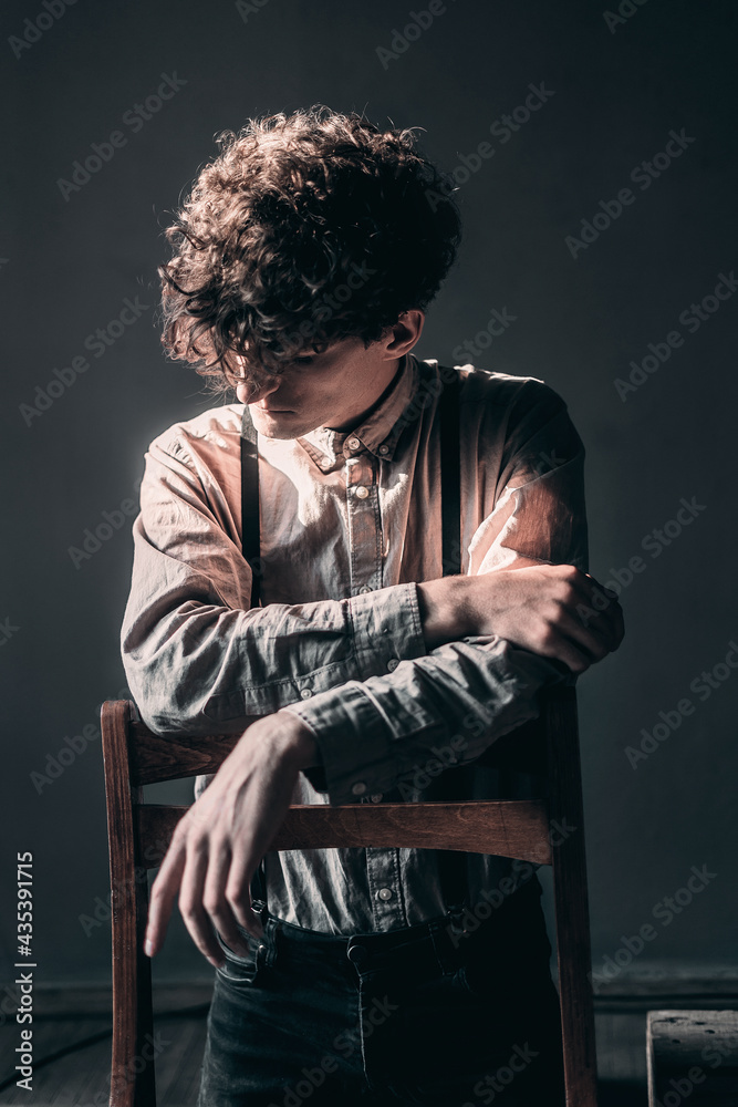 Alone boy in depression with cigarette in vintage a dark room. Stock ...