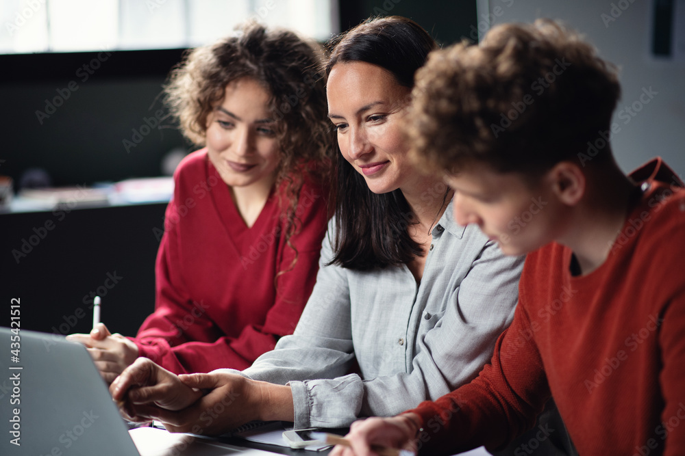 Group of young people attending education class in community center ...