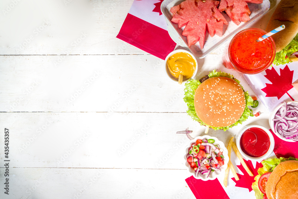 Set of various Canada Day bbq food. Picnic party table with maple leaf ...