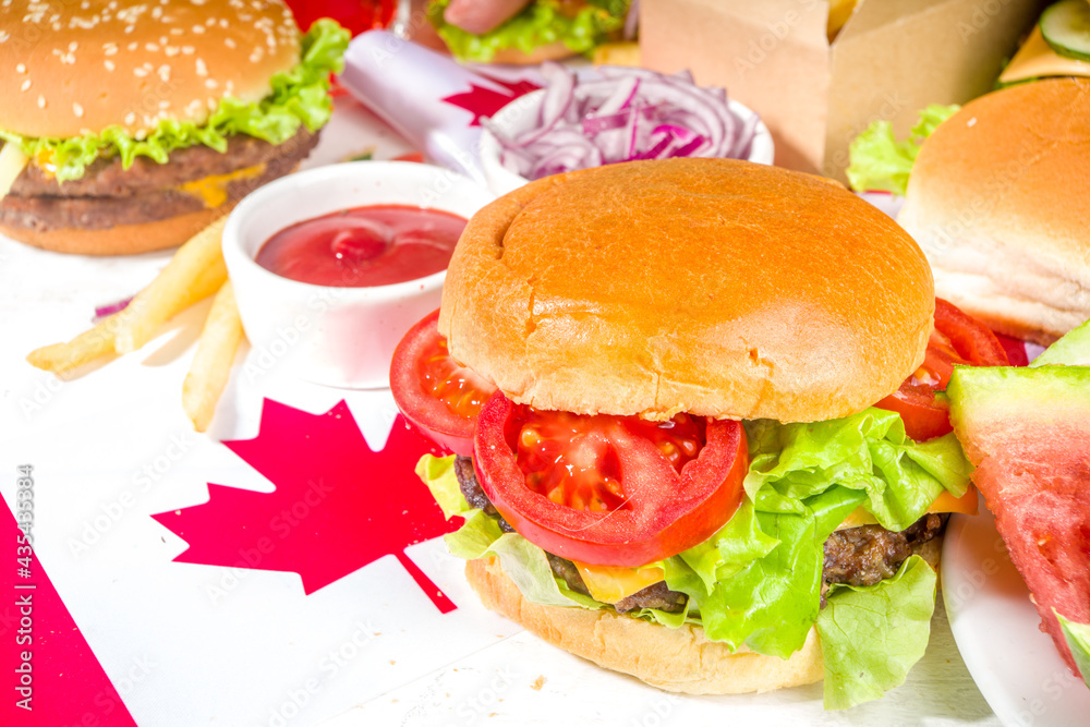 Set of various Canada Day bbq food. Picnic party table with maple leaf ...