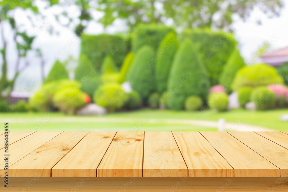 Wood floor with blurred trees of nature park background and summer ...