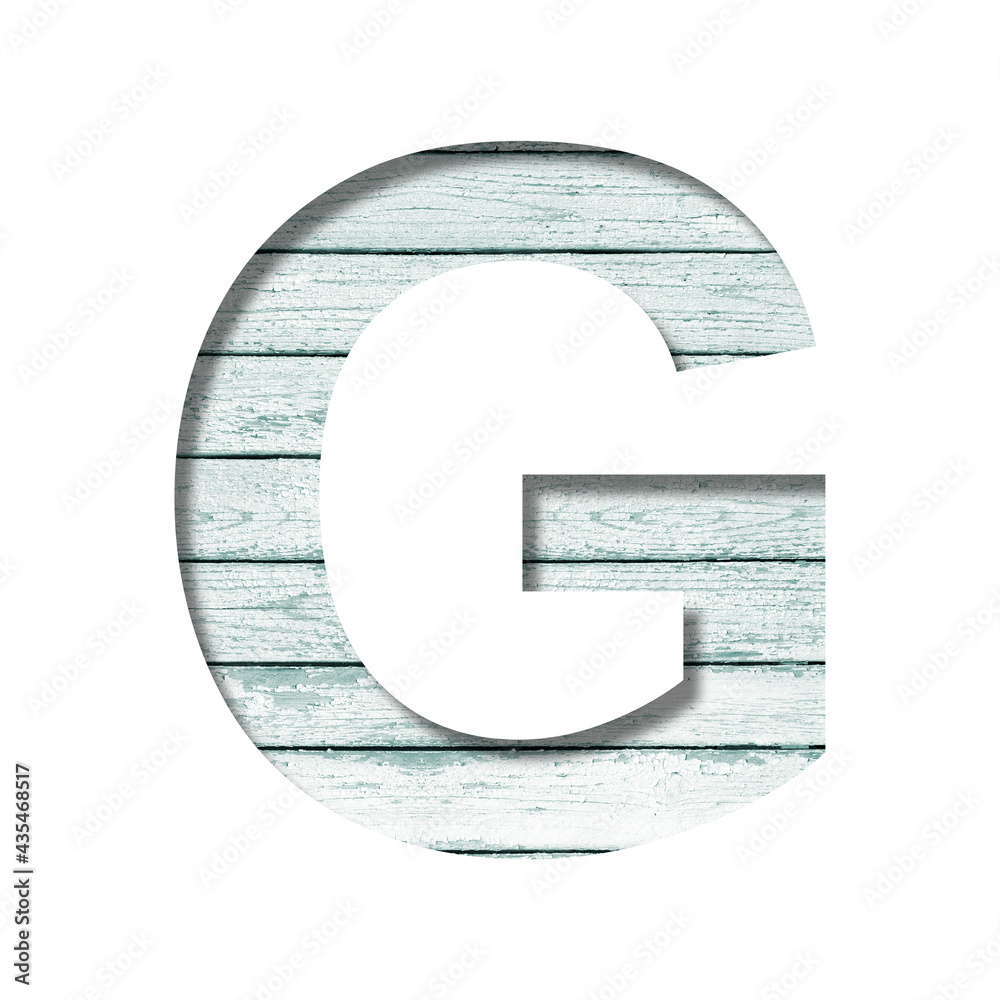 Font on old boards. The letter G cut out of paper on a rustic wall of ...