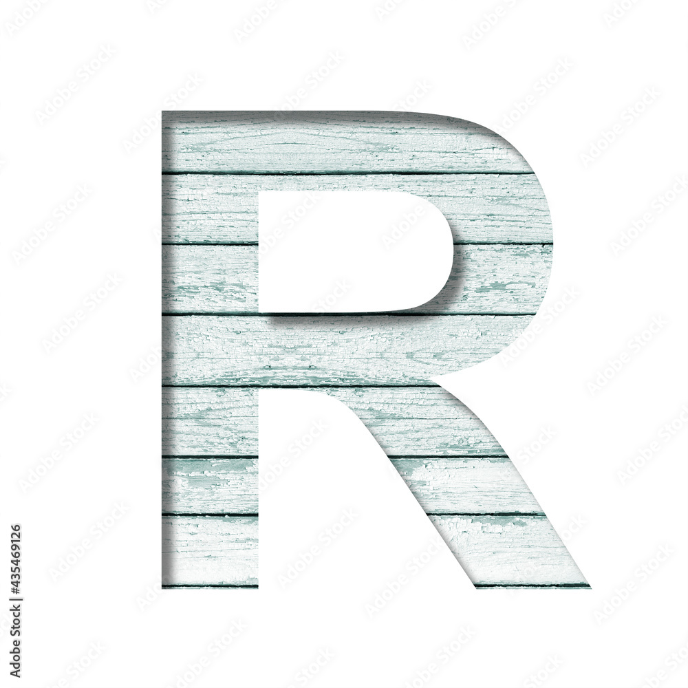 Font on old boards. The letter R cut out of paper on a rustic wall of ...
