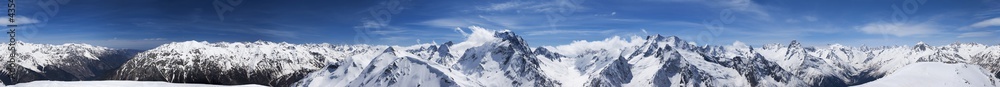 Cylindrical panorama 360 degrees of high snow-capped mountain peaks ...