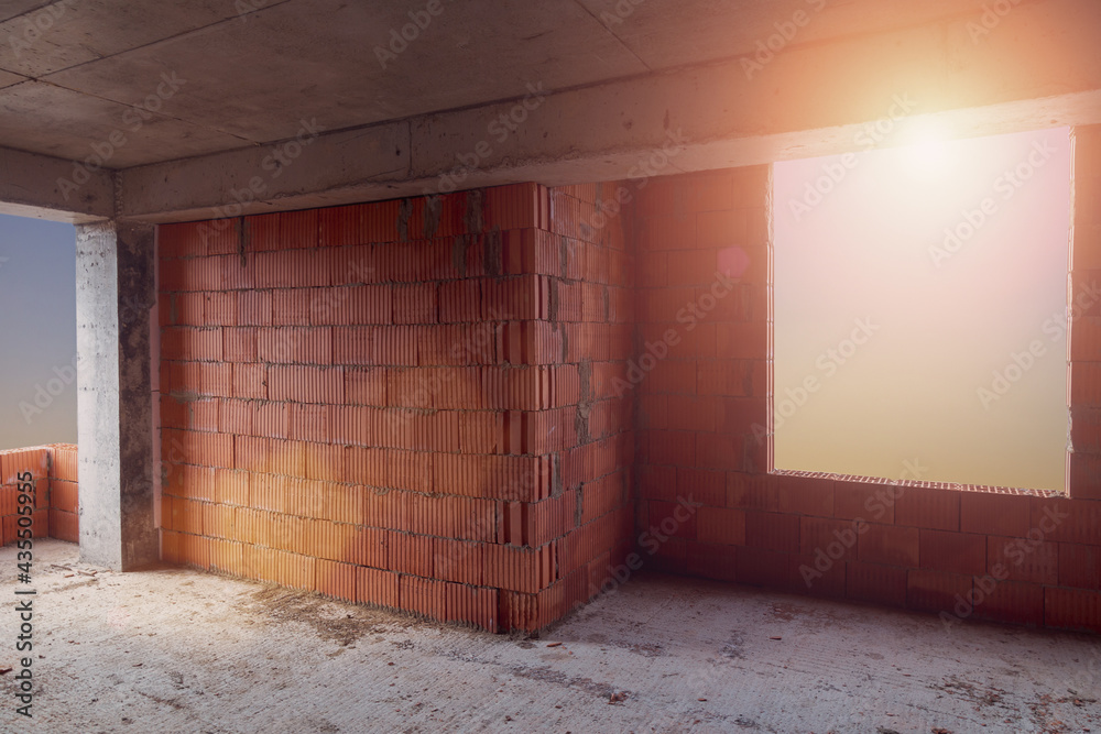 room in a building under construction. Multi-storey residential ...