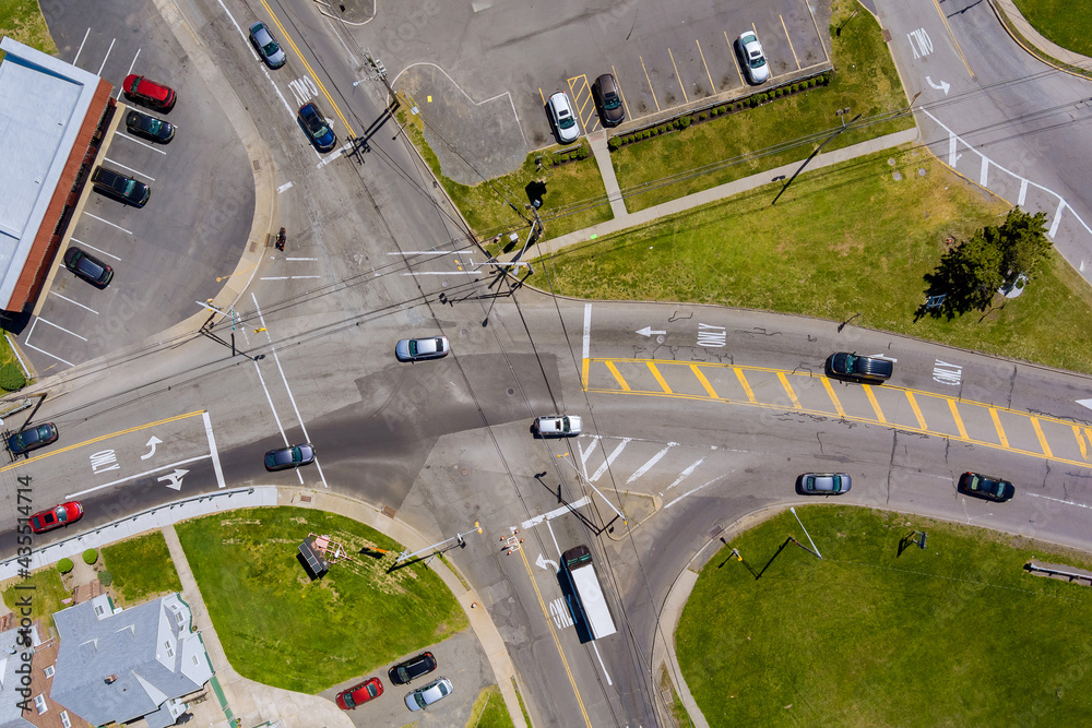 Major asphalt road with multiple lanes, with a traffic light a ...