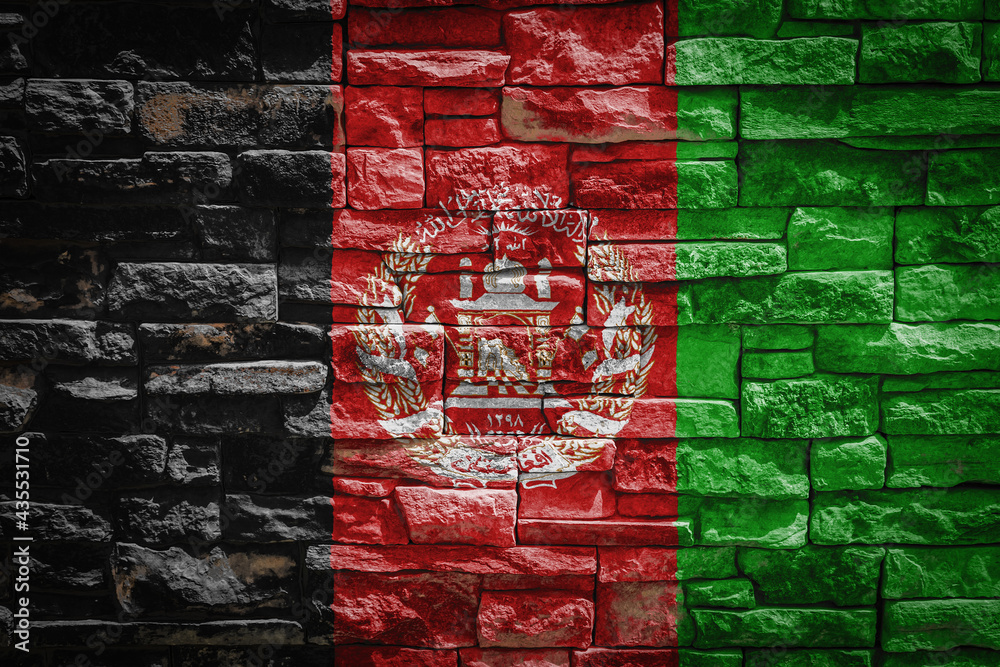 National flag of Afghanistan on stone wall background.The concept of ...