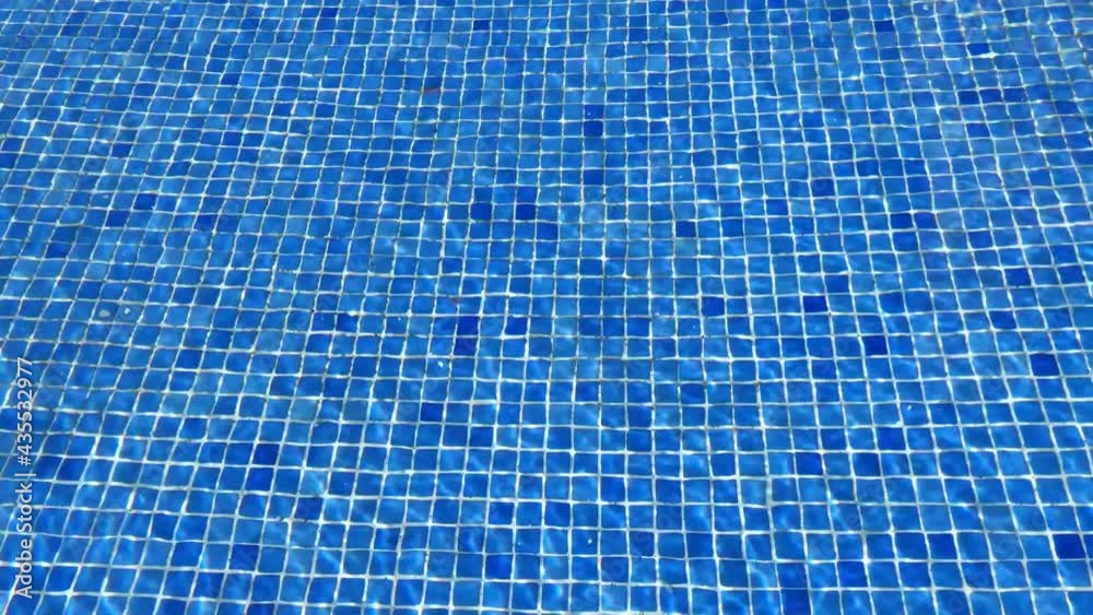 Water moving in swimming pool, blue tile. Texture of water. Video in 4K ...
