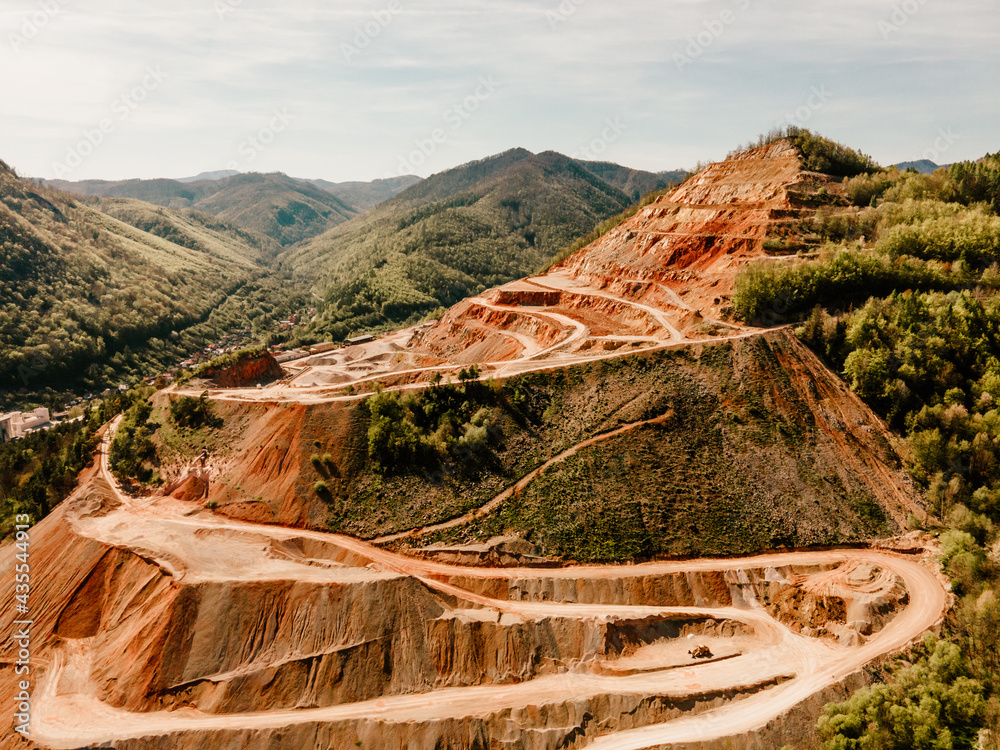 Open pit mine, aerial view. Bottom of surface mining and machinery in ...