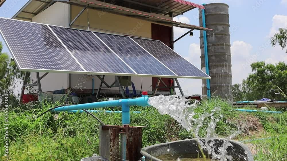 Water flows from the PVC pipe. The silver groundwater is pumped by a ...